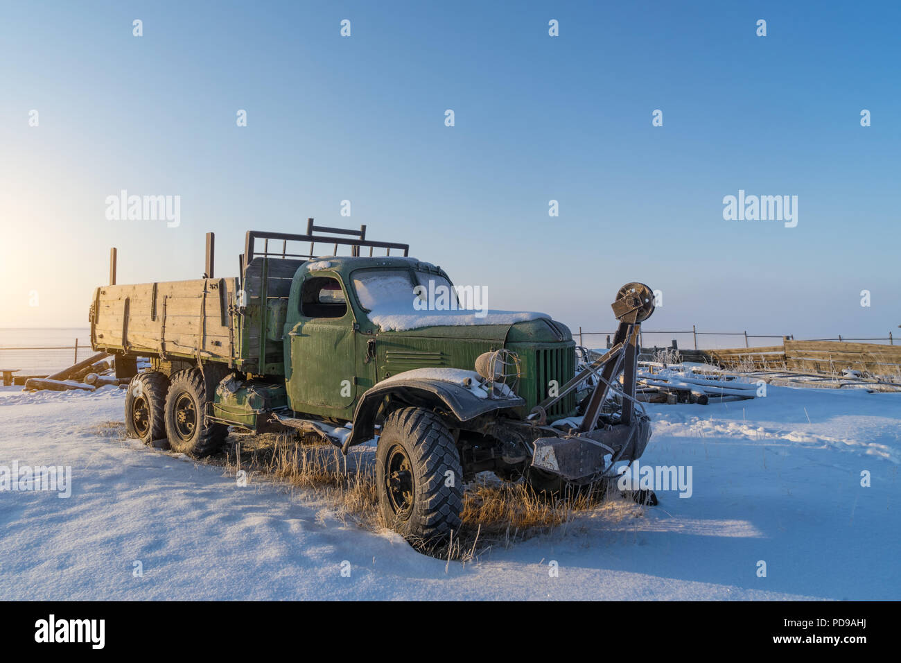 Old Russian truck covered by snow in the winter. Baikal lakeI, Russia ...