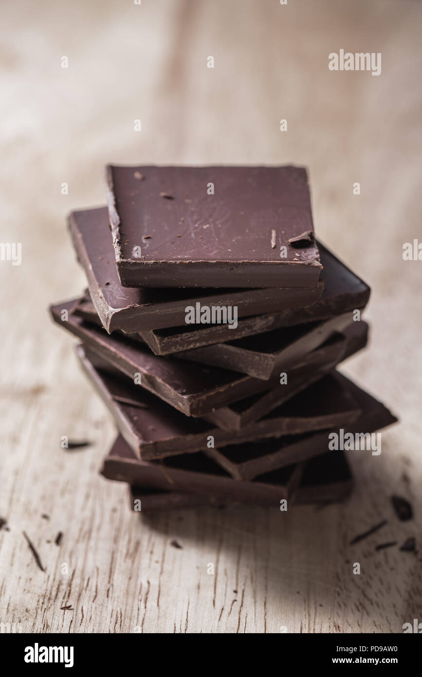 Stack of Chocolate Bars on Wooden Surface. Vertical Orientation Stock ...