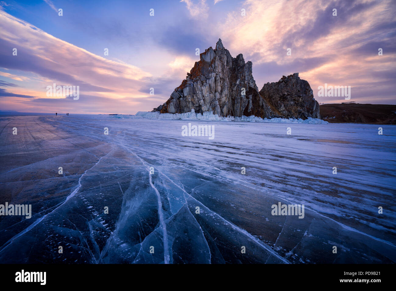 Lake Baikal during warm sunrise in winter. Beautiful rocks and crack ...