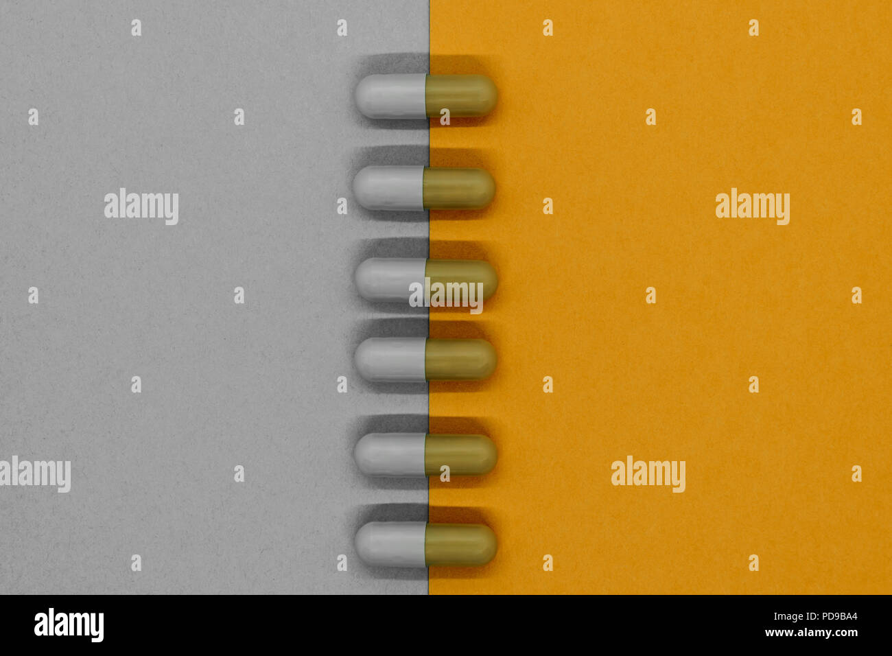 Abstract composition of separated in grey and orange colors medication ...