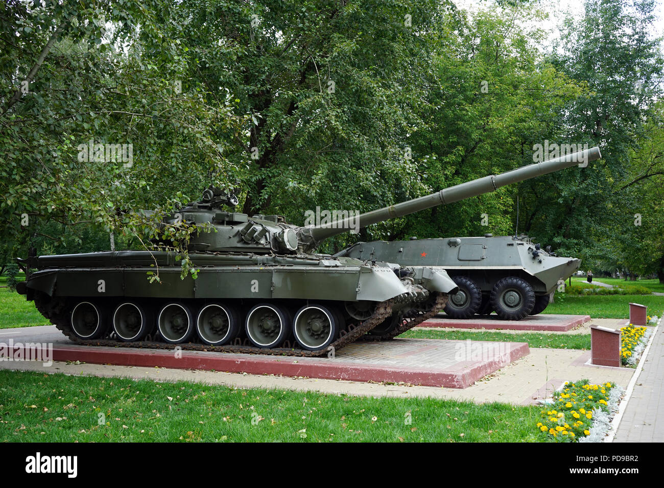 Soviet green tank and BTR in park, Moscow Stock Photo - Alamy