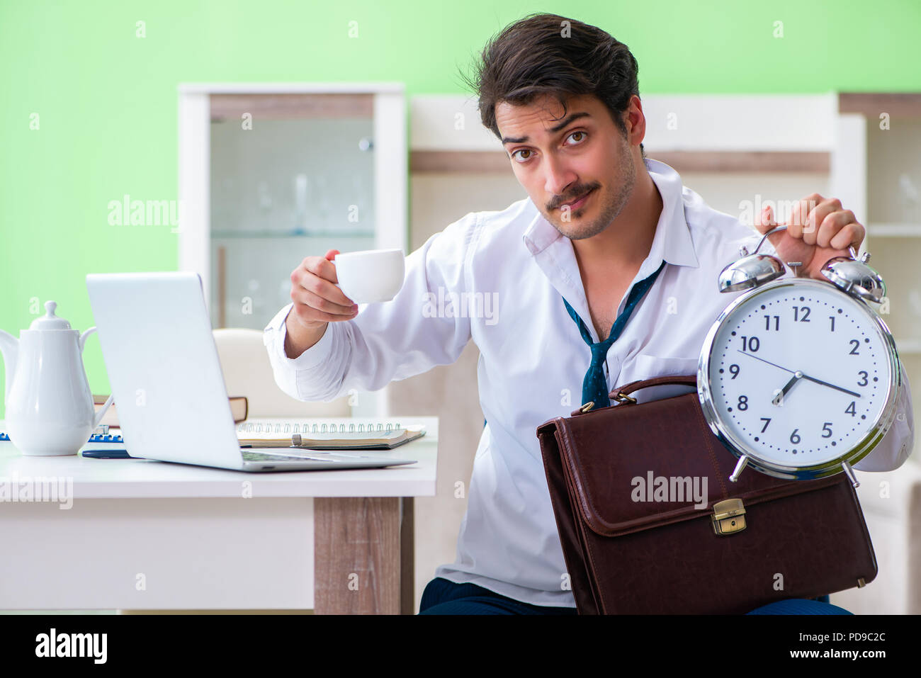 Man dressing up and late for work Stock Photo - Alamy