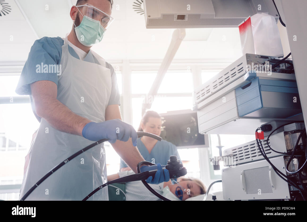 Internist doctors during stomach examination Stock Photo - Alamy