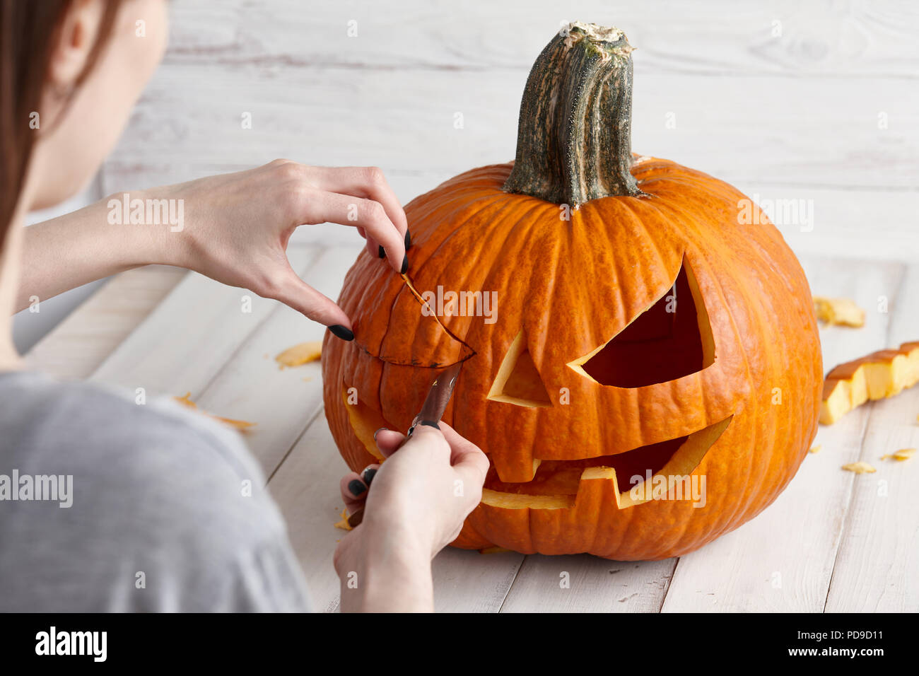 Carving halloween pumpkin into jack-o-lantern, close up view Stock ...