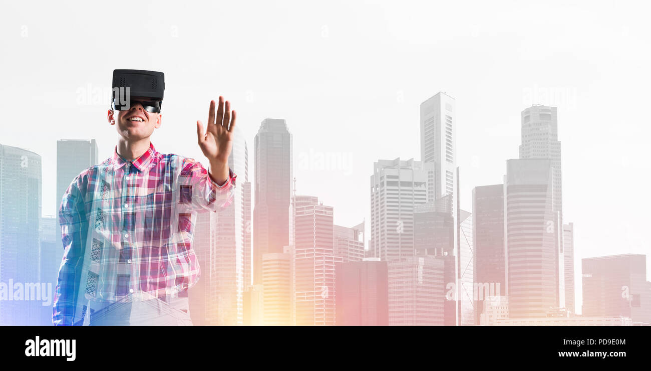Guy wearing checked shirt and virtual mask stretching hand to touch ...