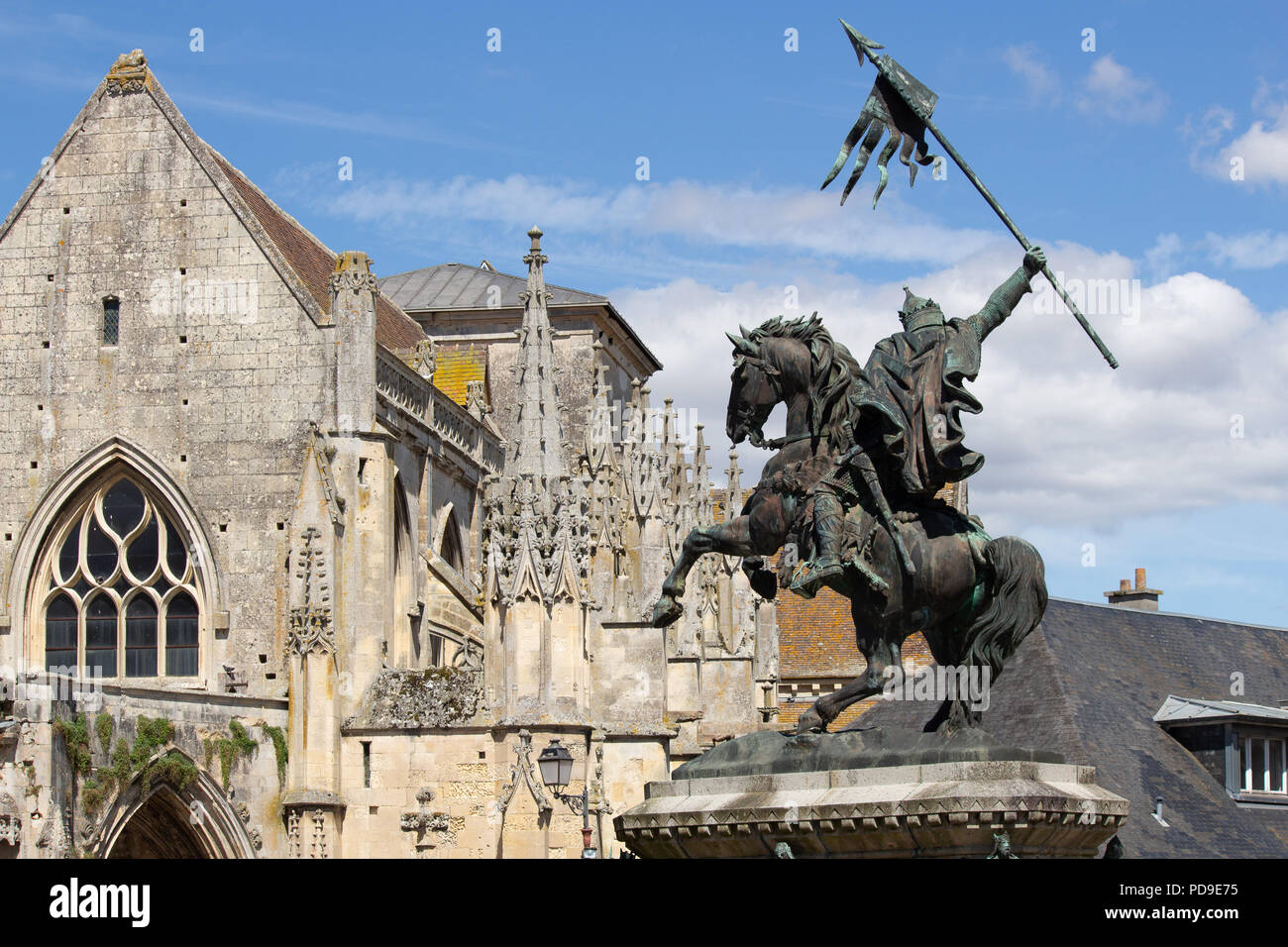 Statue of William the Conqueror in front of Church of the Trinity ...