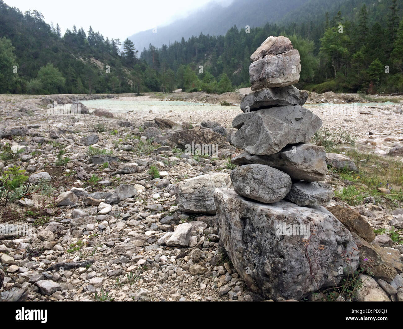 Stacking stones in the Alps - fleeting art Stock Photo - Alamy