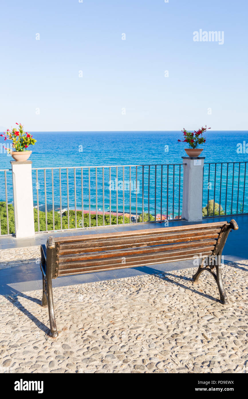 Empty bench overlooking calm sea bench hi-res stock photography and ...