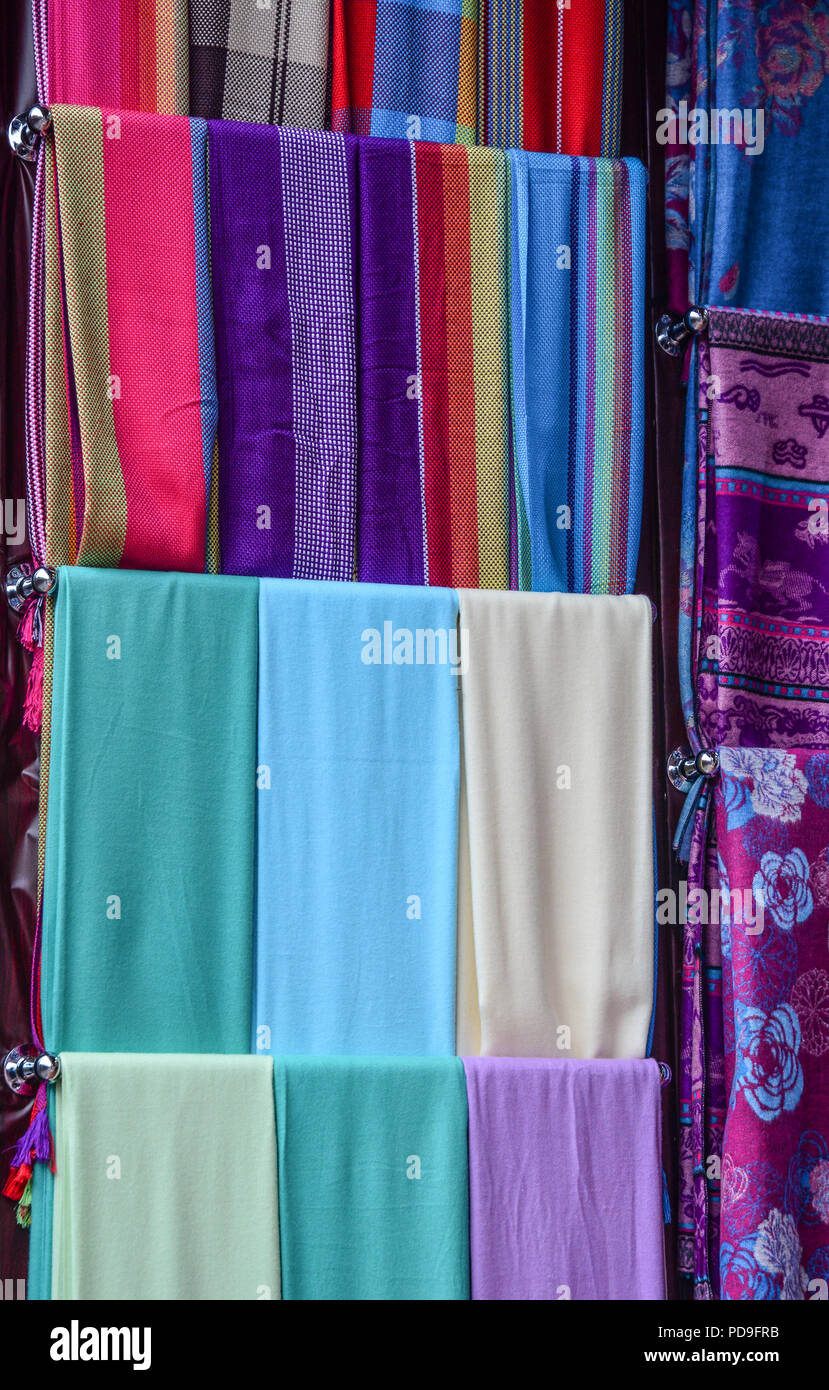 Colorful textile for sale at a street market in Fenghuang Town, China ...