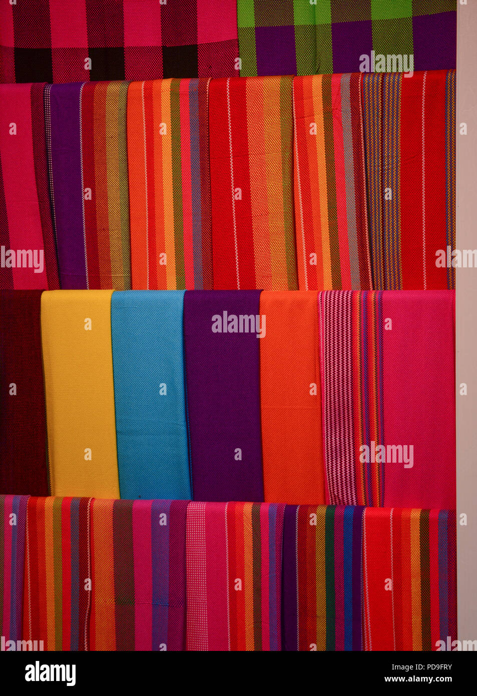 Colorful textile for sale at a street market in Fenghuang Town, China ...