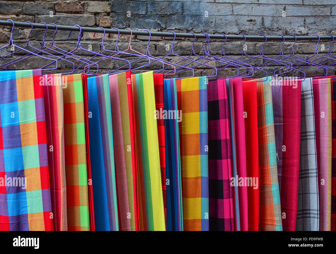 Colorful textile for sale at a street market in Fenghuang Town, China ...
