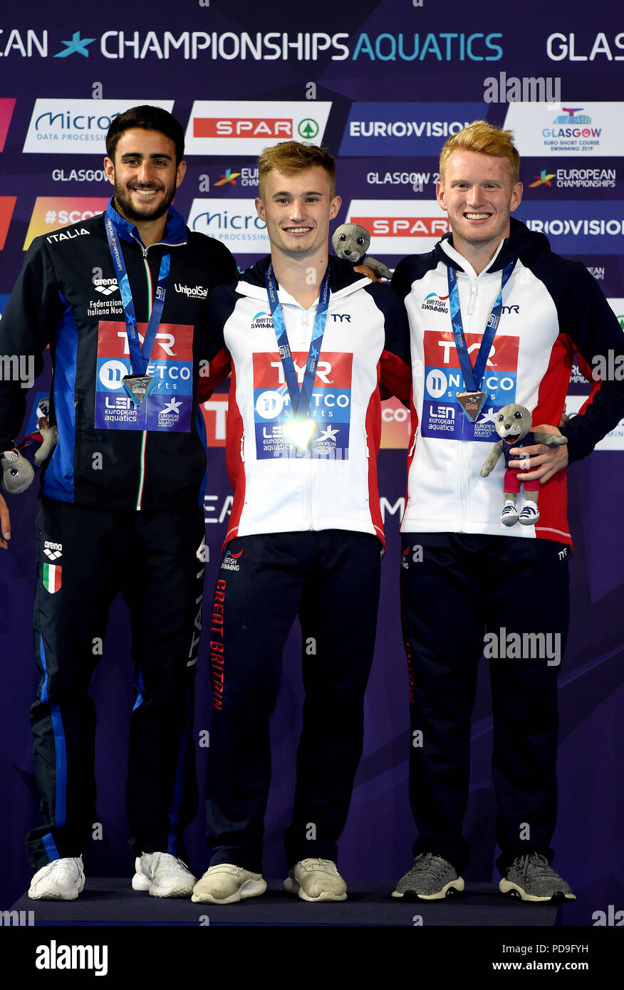 Great Britain's Jack Laugher (centre) with his gold medal, Italy's ...