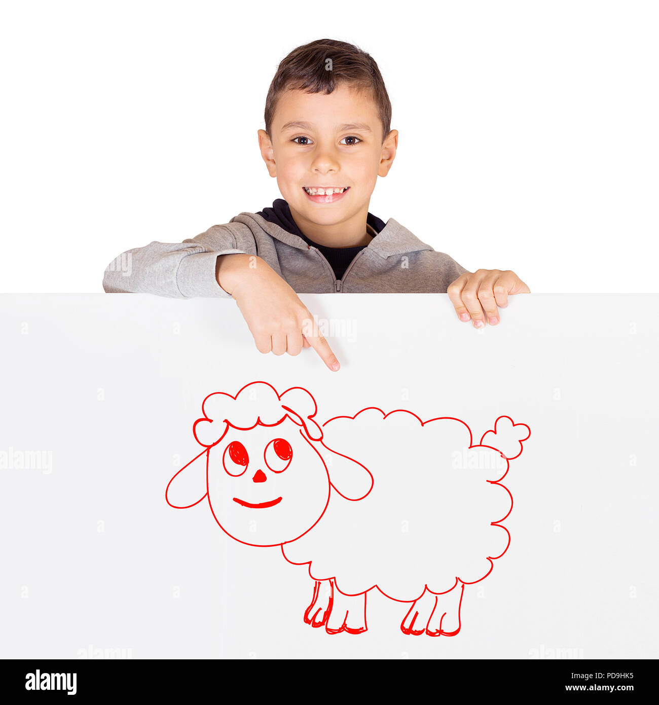 Young boy showing white board with drawing of sheep - celebrating Eid ...