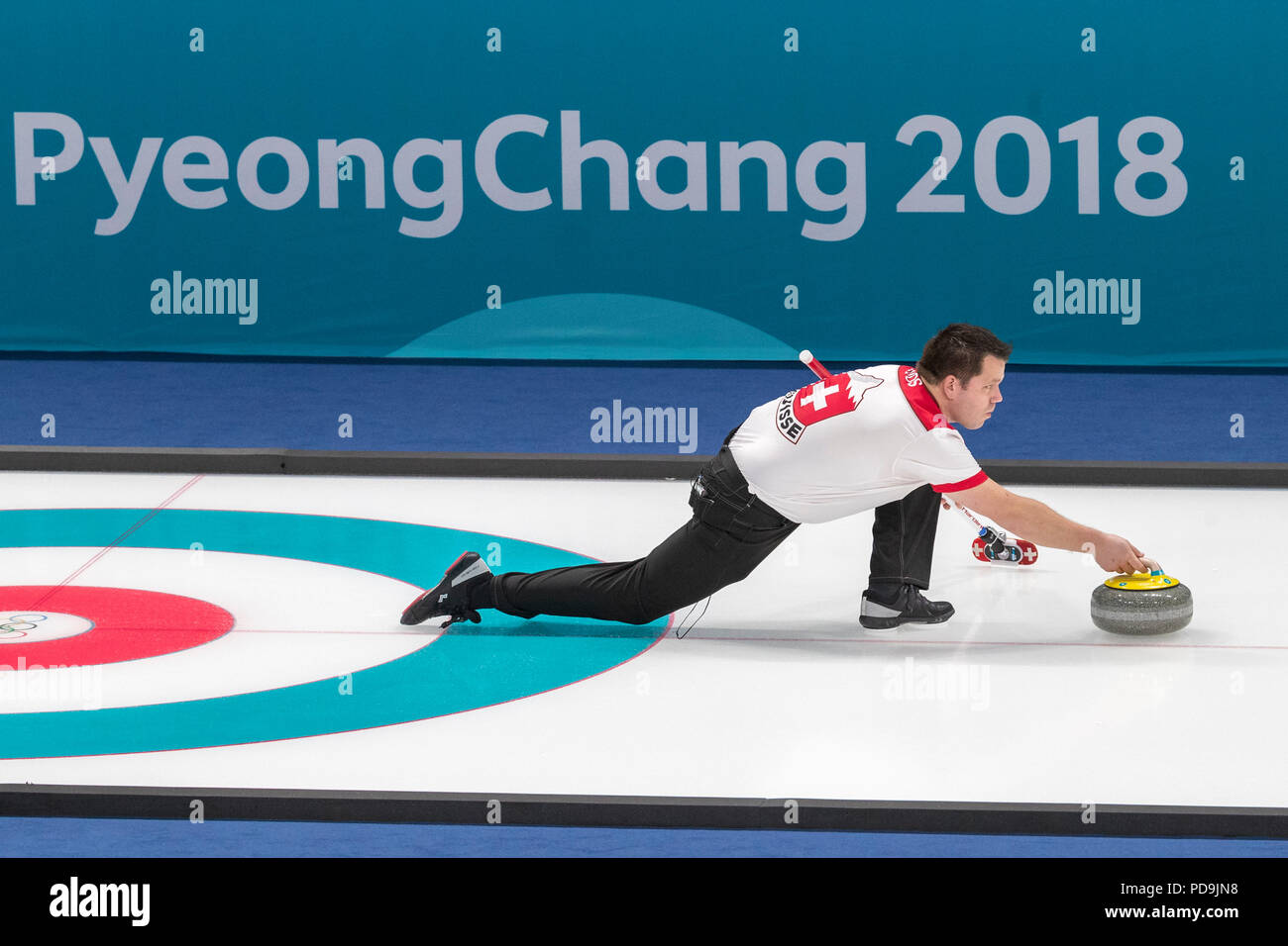 Martin Rios competing in the Mixed Doubles Curling round robin at the ...