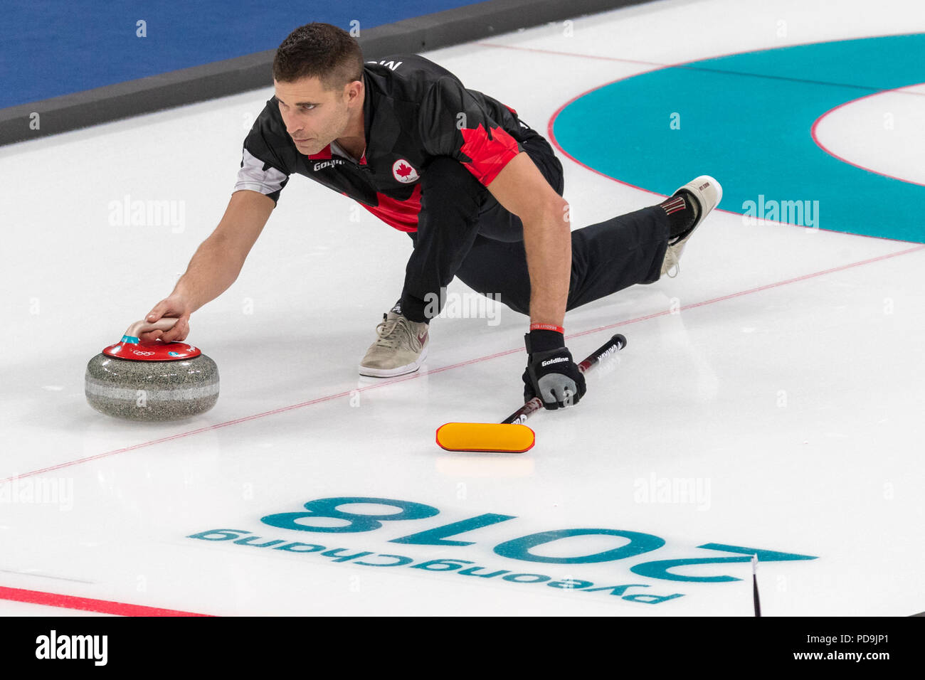 John Morris (CAN) competing in the Mixed Doubles Curling round robin at ...