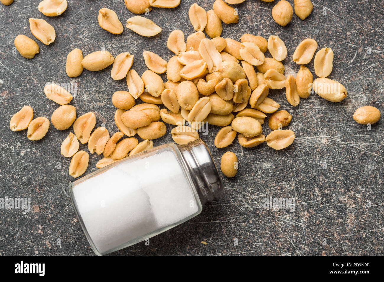 Salted roasted peanuts and salt cellar Stock Photo - Alamy
