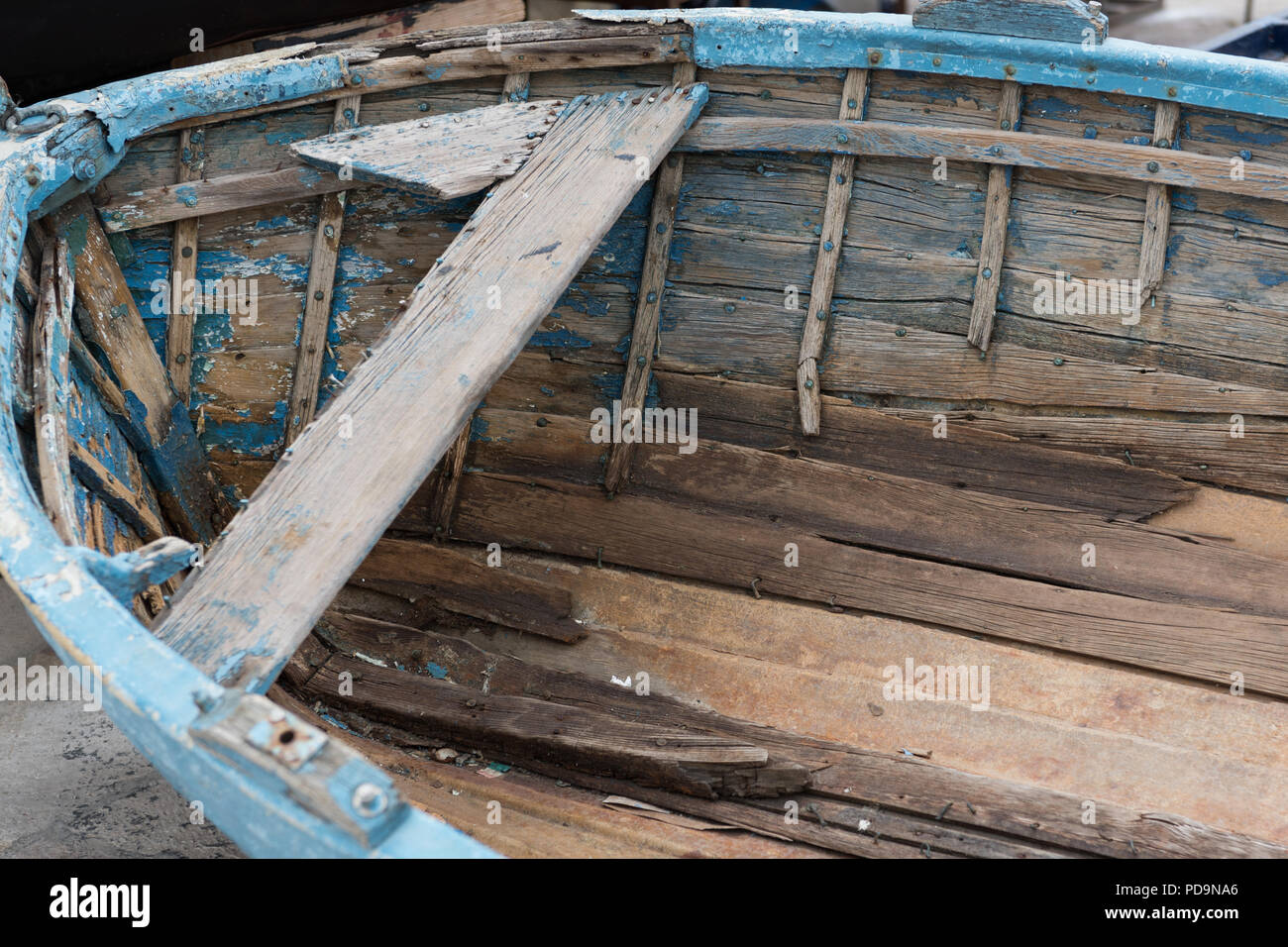 Old blue painted wooden boat with textured planks and rusitc paint ...
