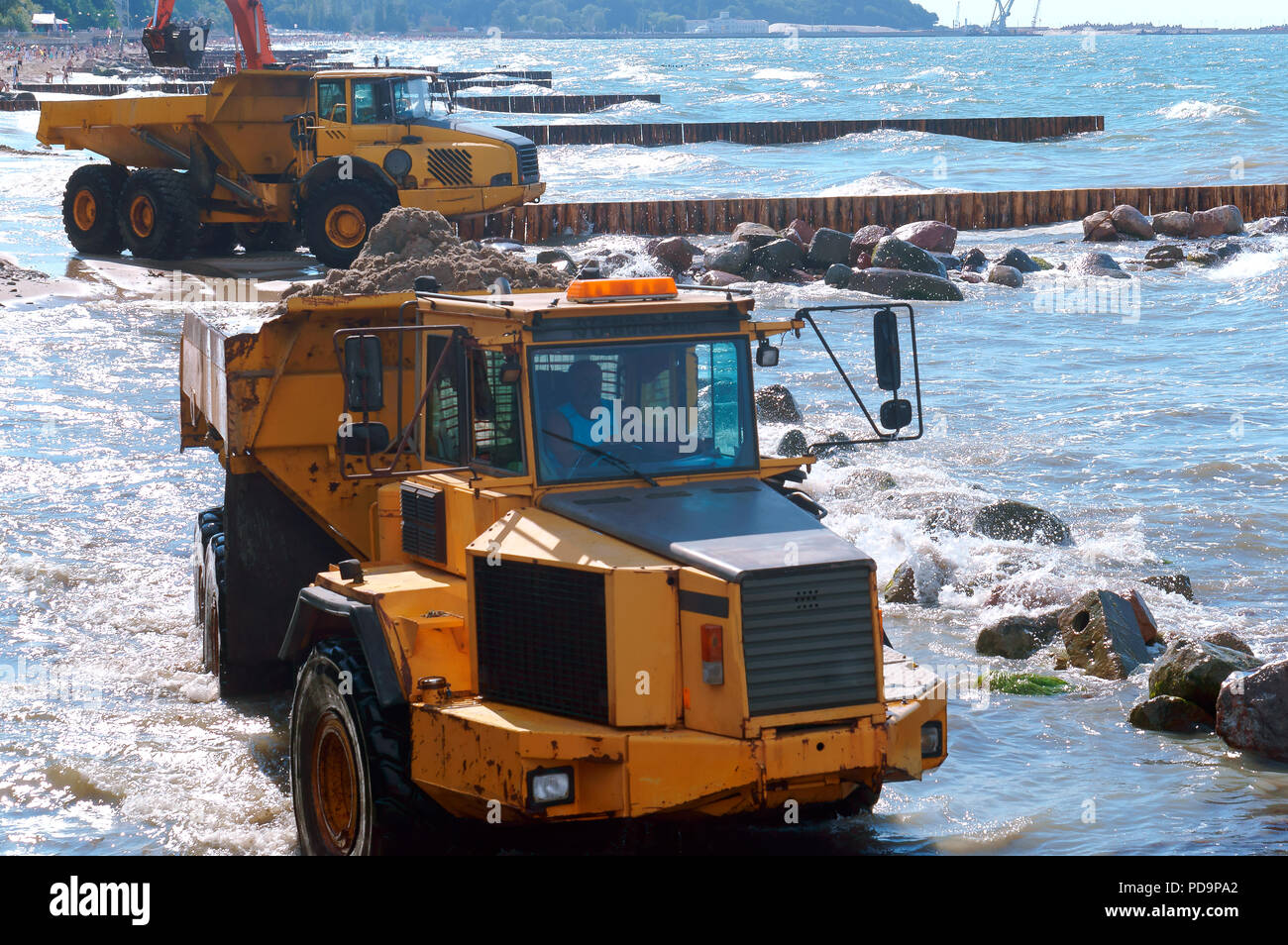 construction equipment on the shore, the construction of breakwaters ...