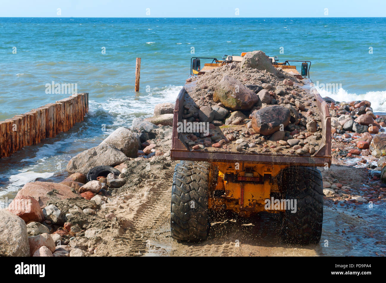 construction equipment on the shore, the construction of breakwaters ...