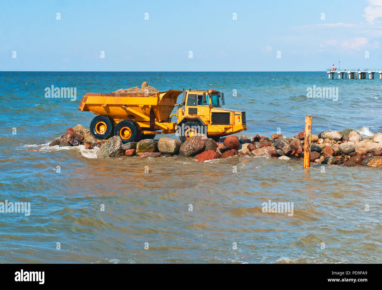 construction equipment on the shore, the construction of breakwaters ...