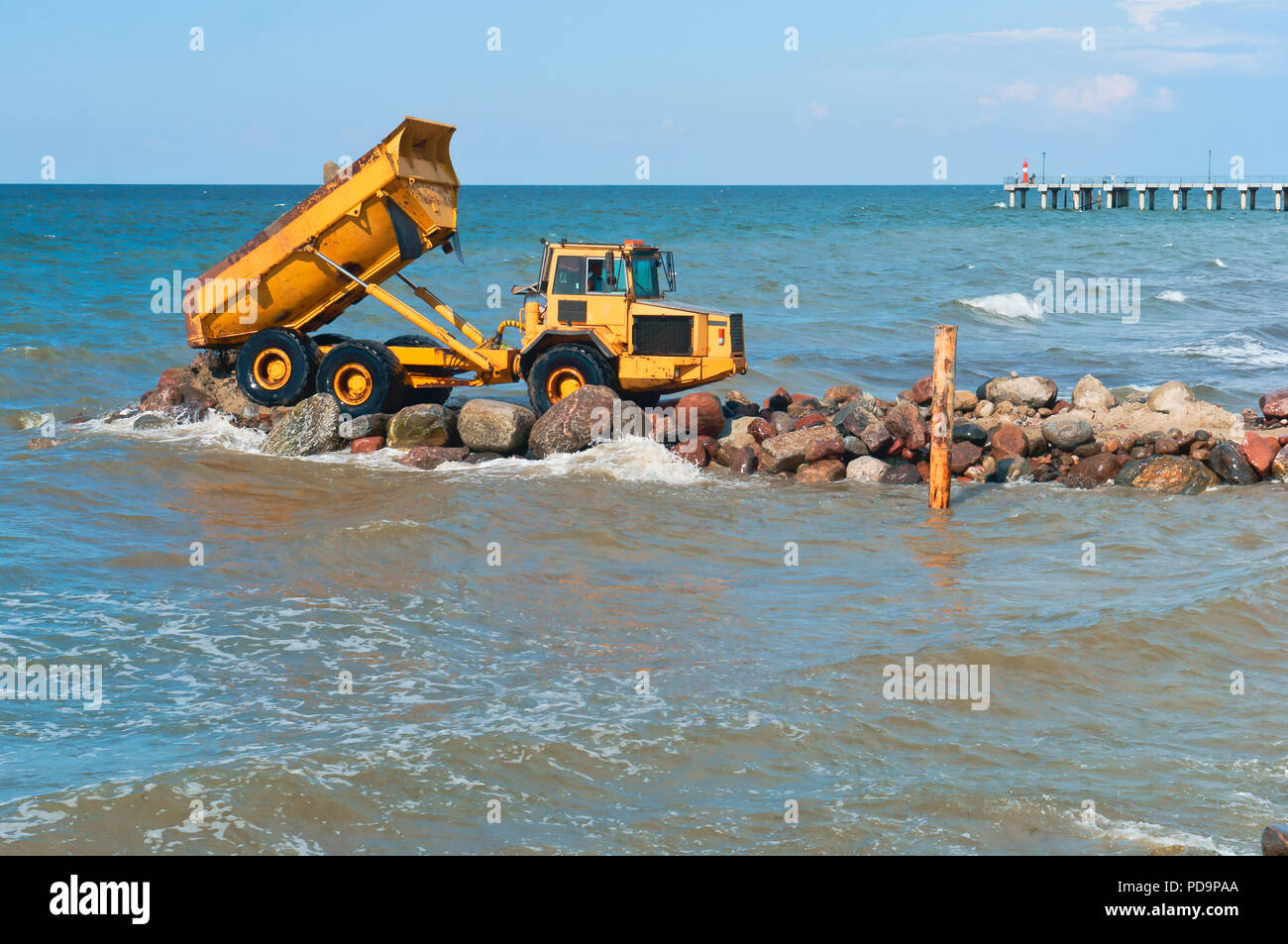 construction equipment on the shore, the construction of breakwaters ...