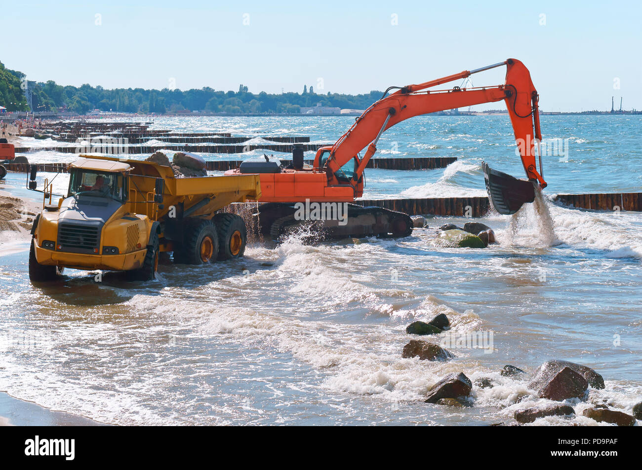 construction equipment on the shore, the construction of breakwaters ...