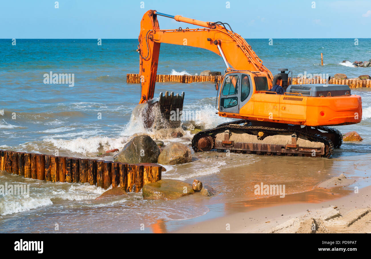construction equipment on the shore, the construction of breakwaters ...