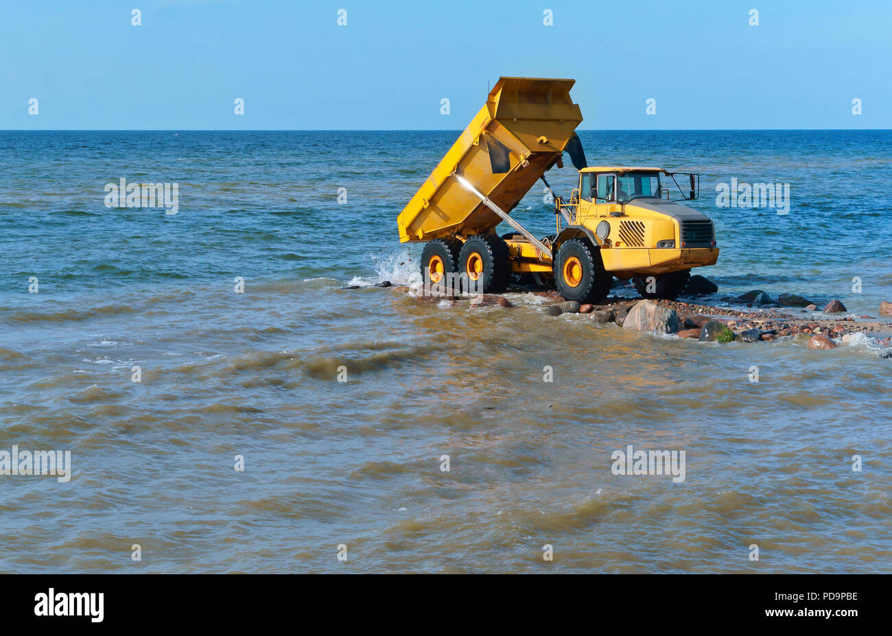 construction equipment on the shore, the construction of breakwaters ...