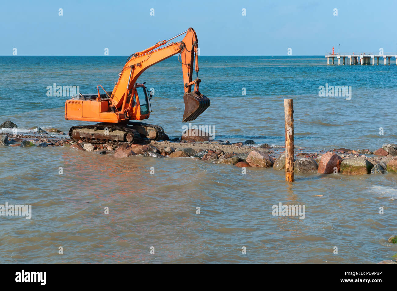 construction equipment on the shore, the construction of breakwaters ...
