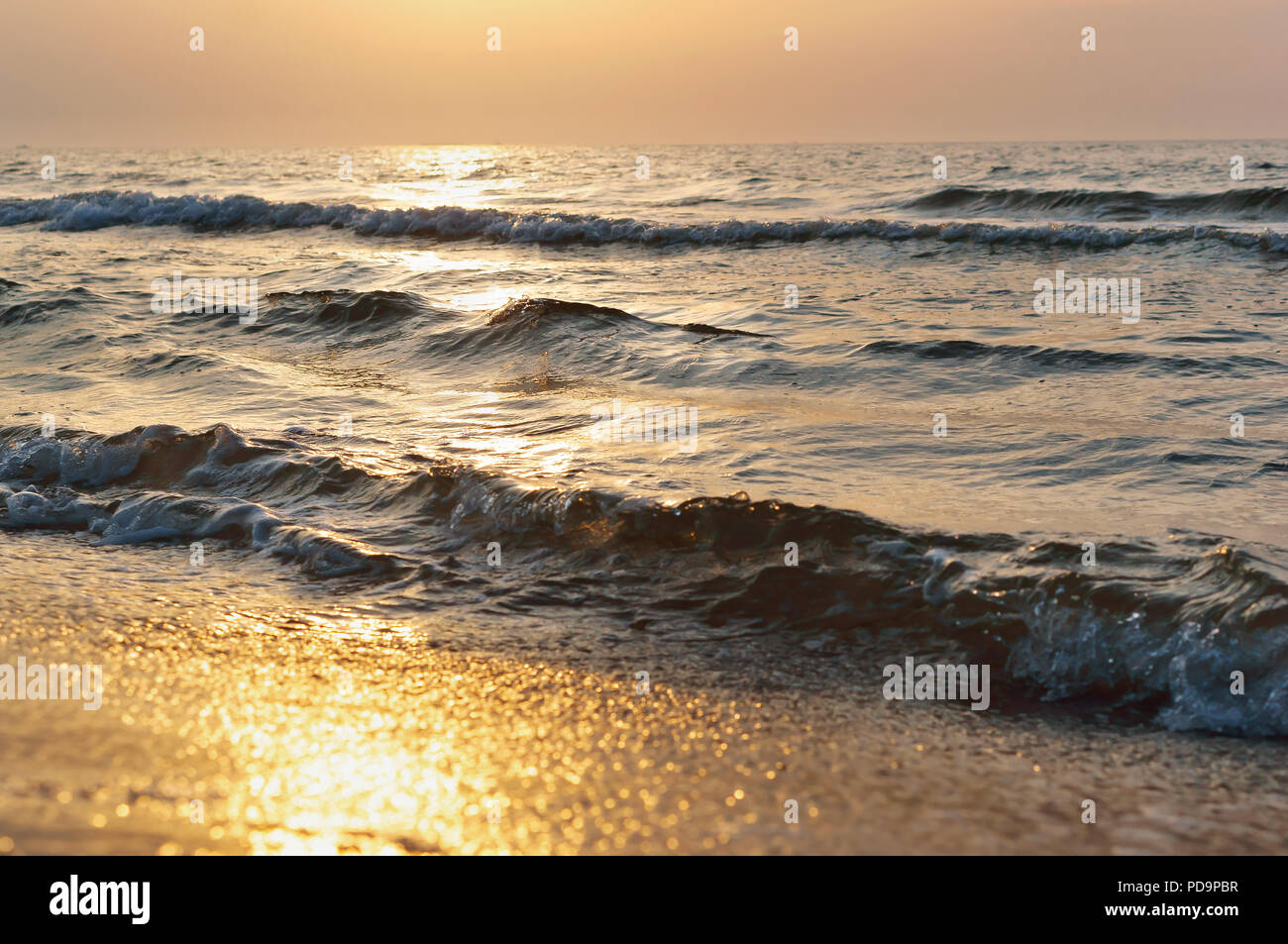 Sunset over the sea. Reflection of sunlight in the sea waves. Red sky ...