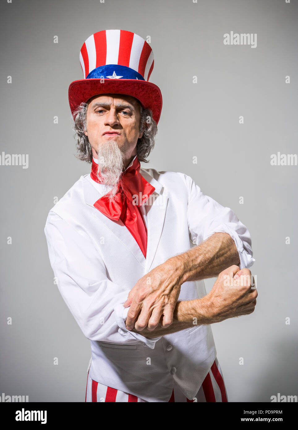 Uncle Sam rolling up his sleeves and getting ready to get to work and ...