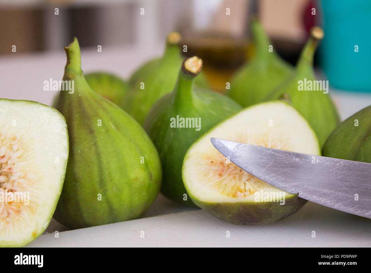 close up to a slide of green fig cut by a knife, ripe fig Stock Photo ...