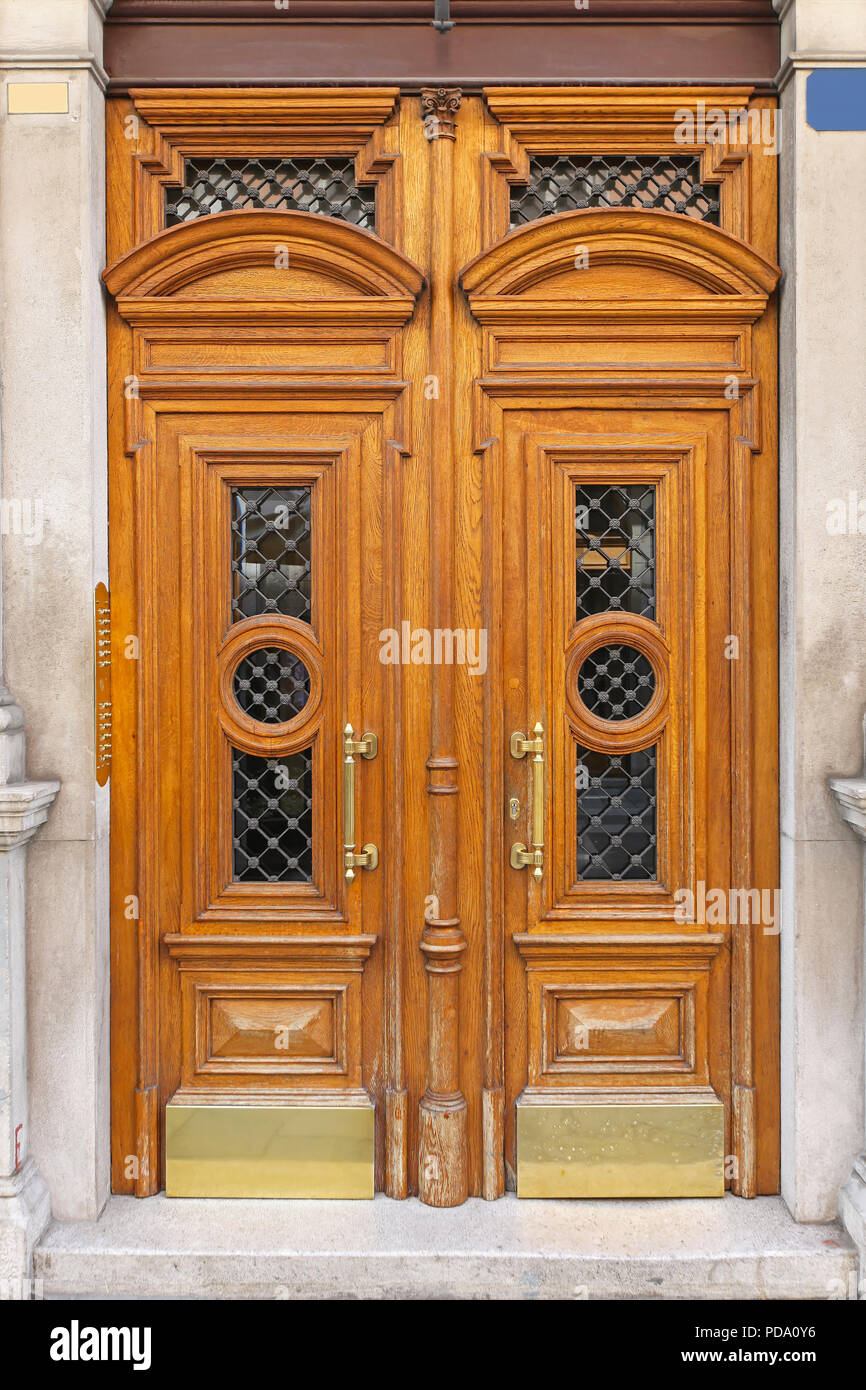 Big double wooden doors in Trieste Stock Photo - Alamy