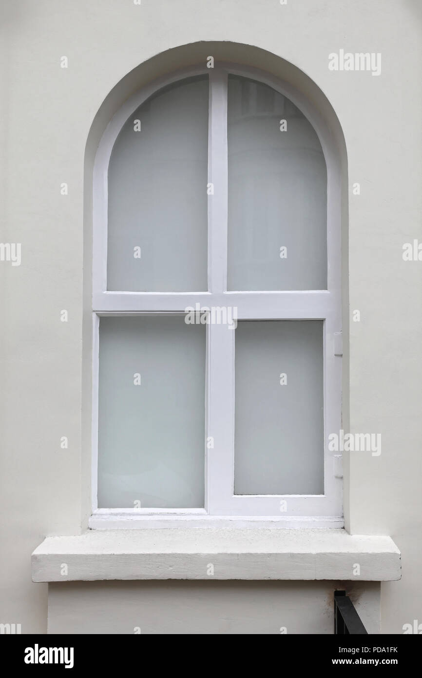 White arch window at simple house Stock Photo - Alamy