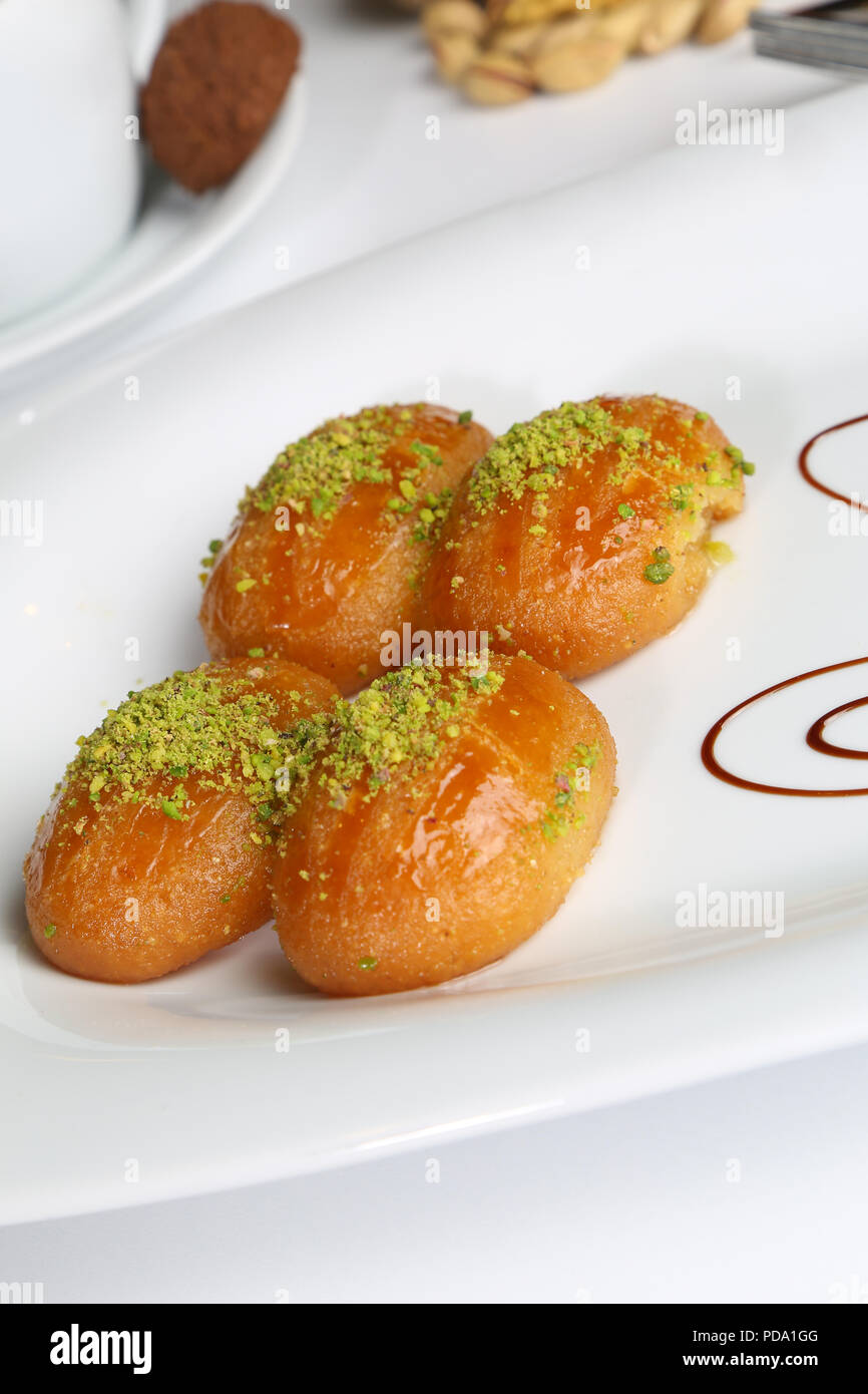 Delicious turkish dessert sekerpare with coconut powder Stock Photo - Alamy