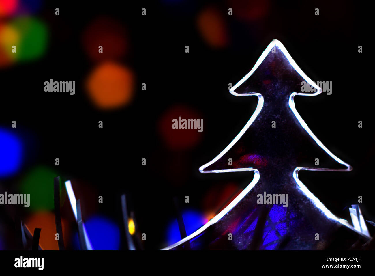 christmas tree and abstract blurred lights on background. Blue, purple ...