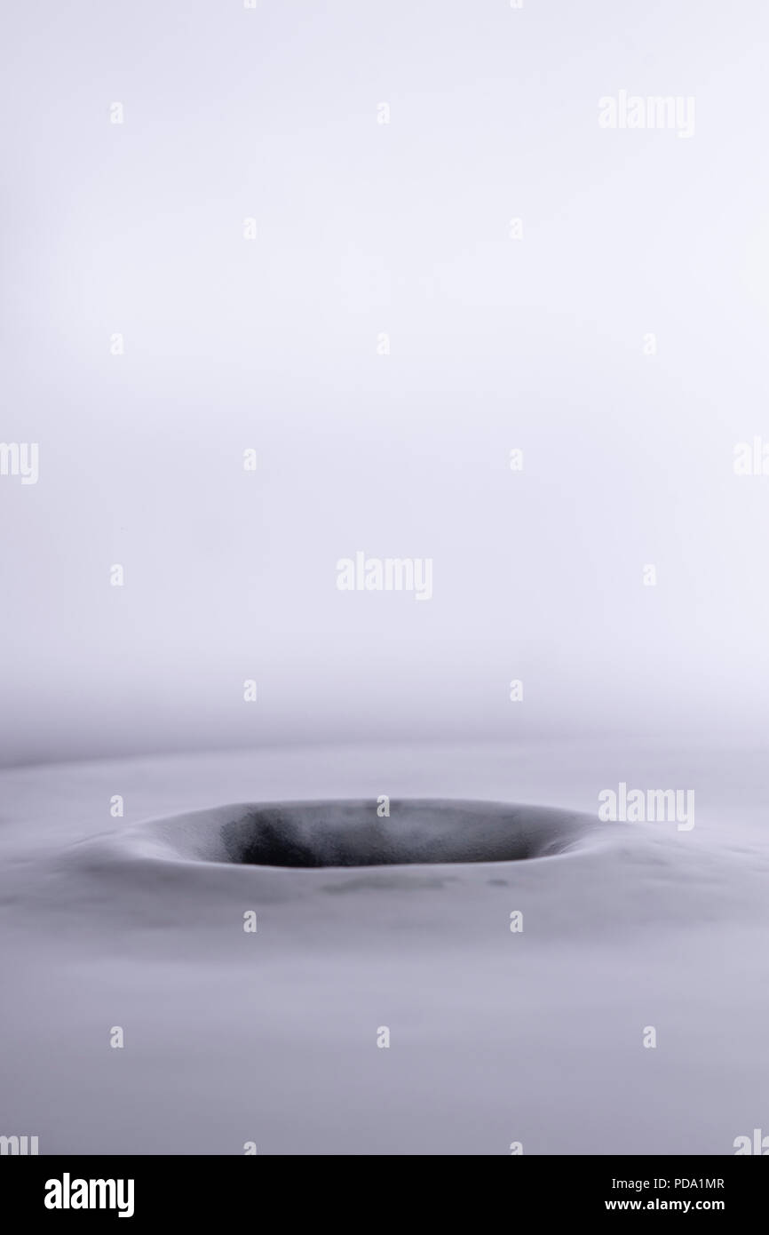 Waterdrop photography creating splash art Stock Photo - Alamy