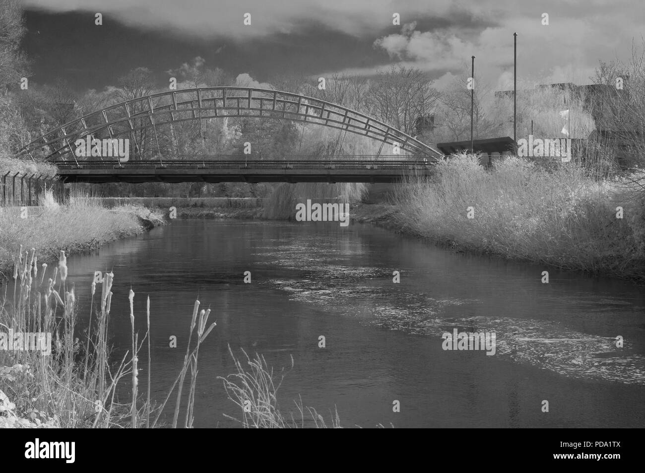 Scenic infrared picture of New Bridge on the River Tone in the centre ...