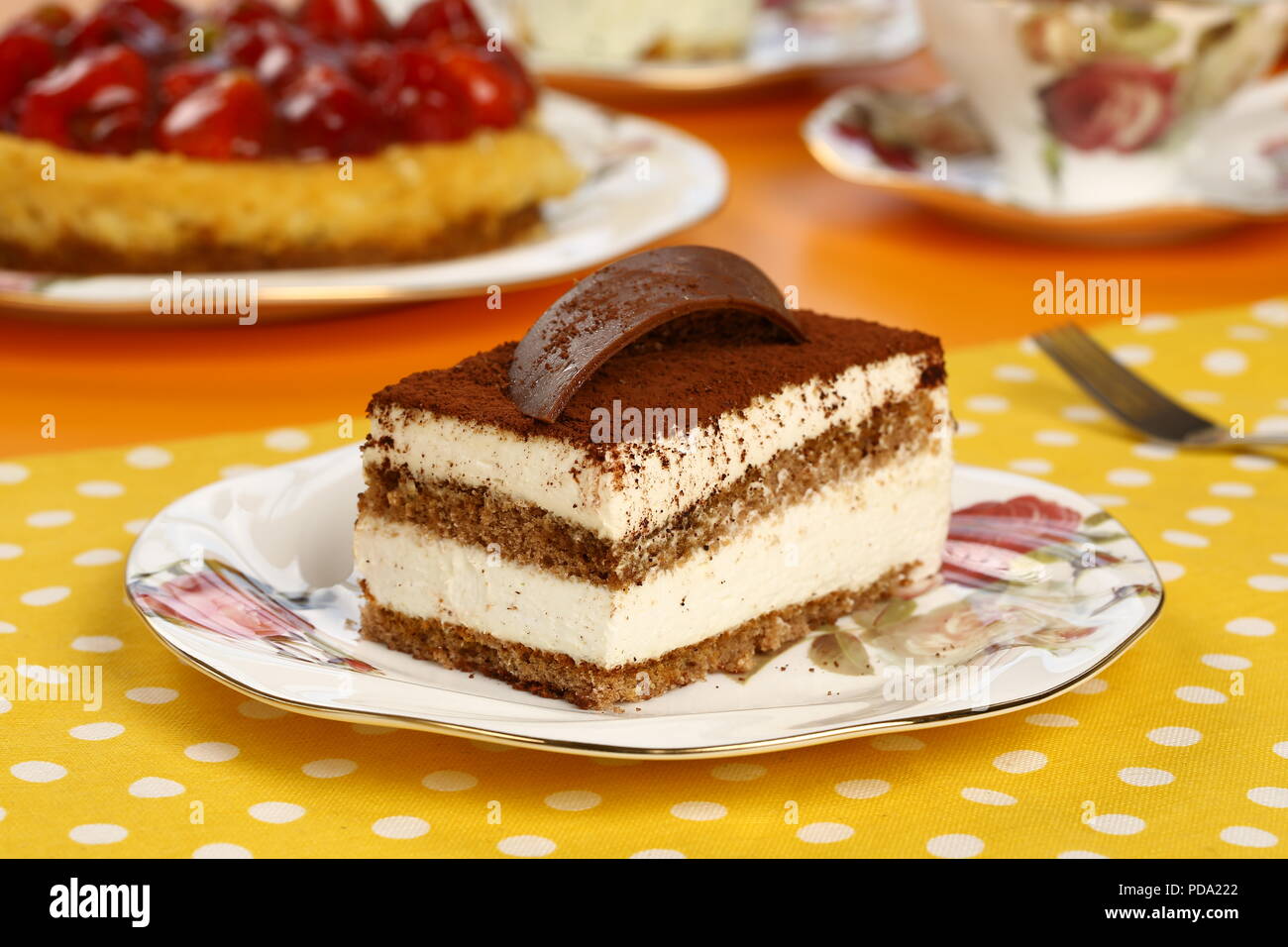 Tiramisu cake on plate Stock Photo - Alamy