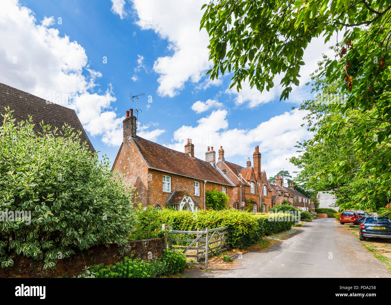 Typical redbrick cottages in a quiet country lane in Little Bedwyn, a ...