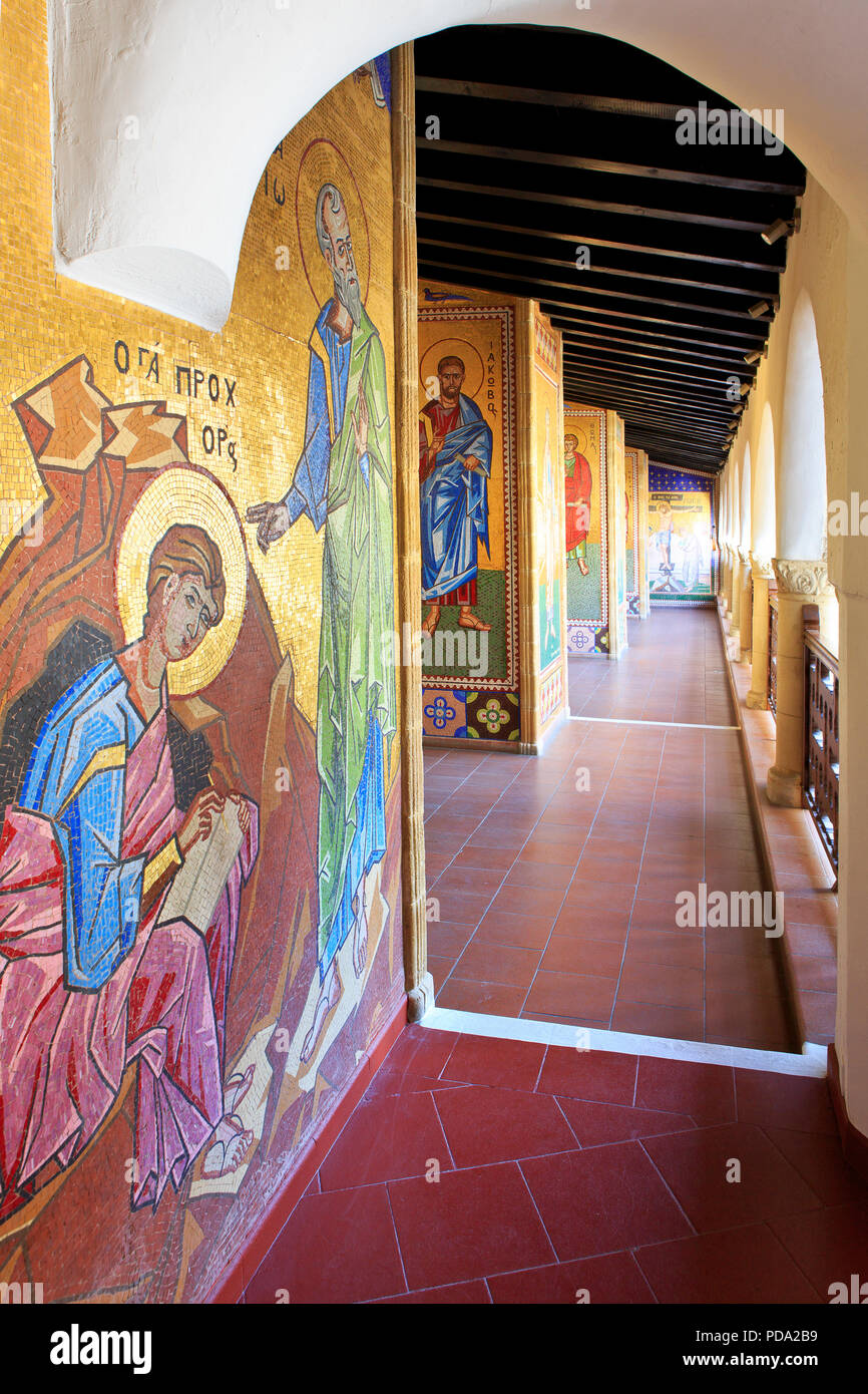 A corridor decorated with mosaics of saints at Kykkos Monastery in ...