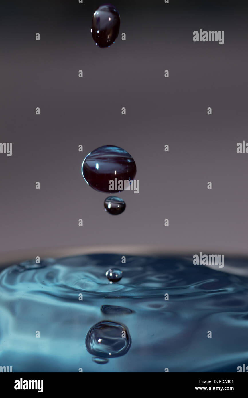 Waterdrop photography creating splash art Stock Photo - Alamy