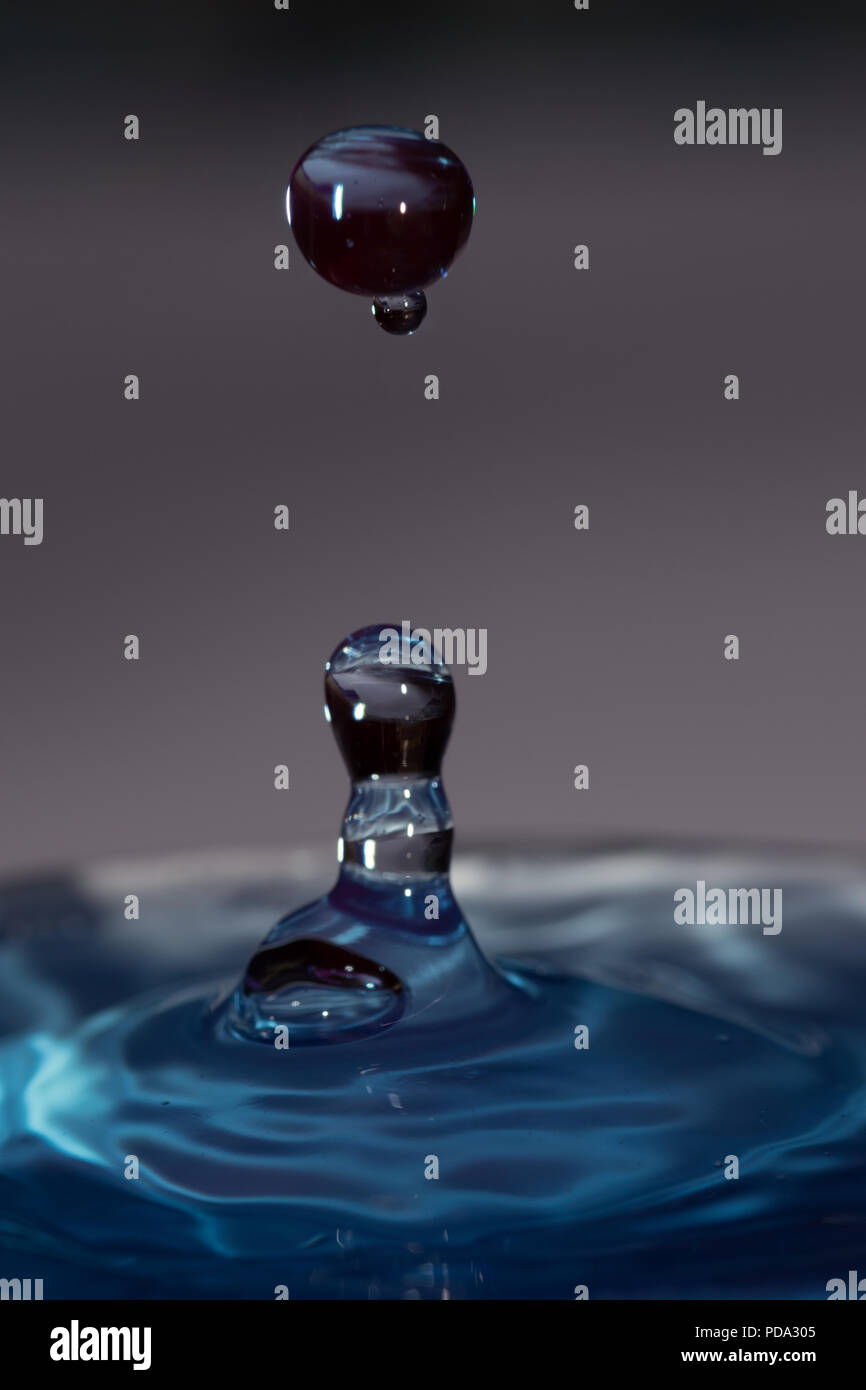 Waterdrop photography creating splash art Stock Photo - Alamy