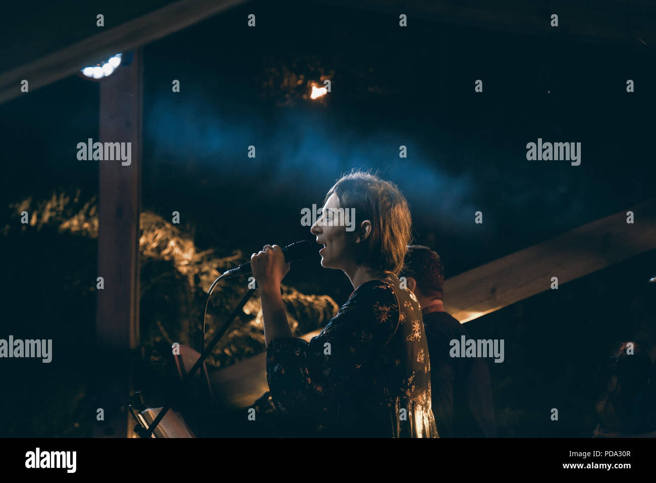 Woman on stage microphone hi-res stock photography and images - Alamy