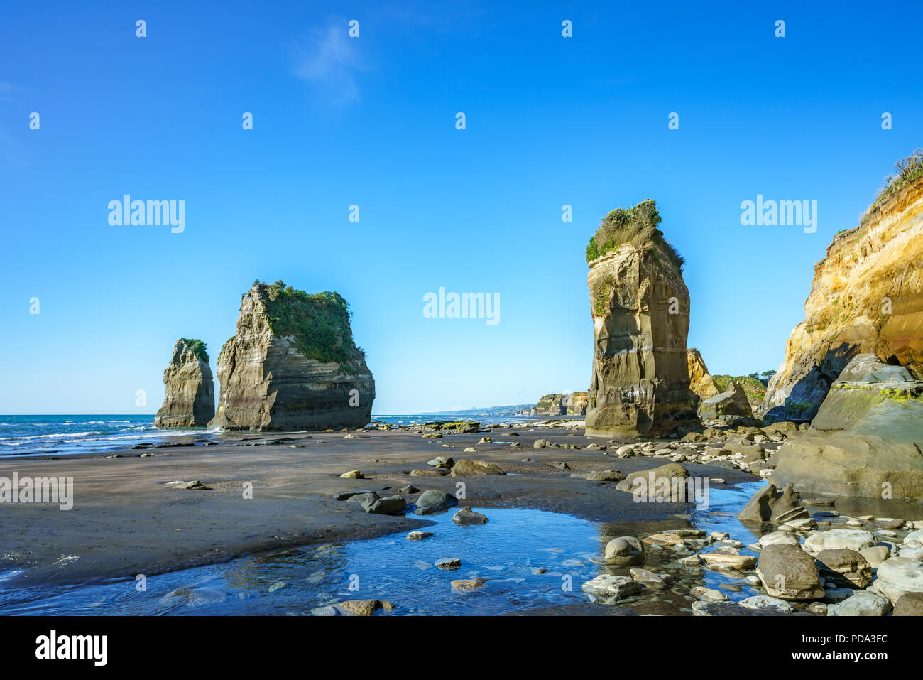 blue water, golden rocks and sand. on the beach, 3 sisters and elephant ...
