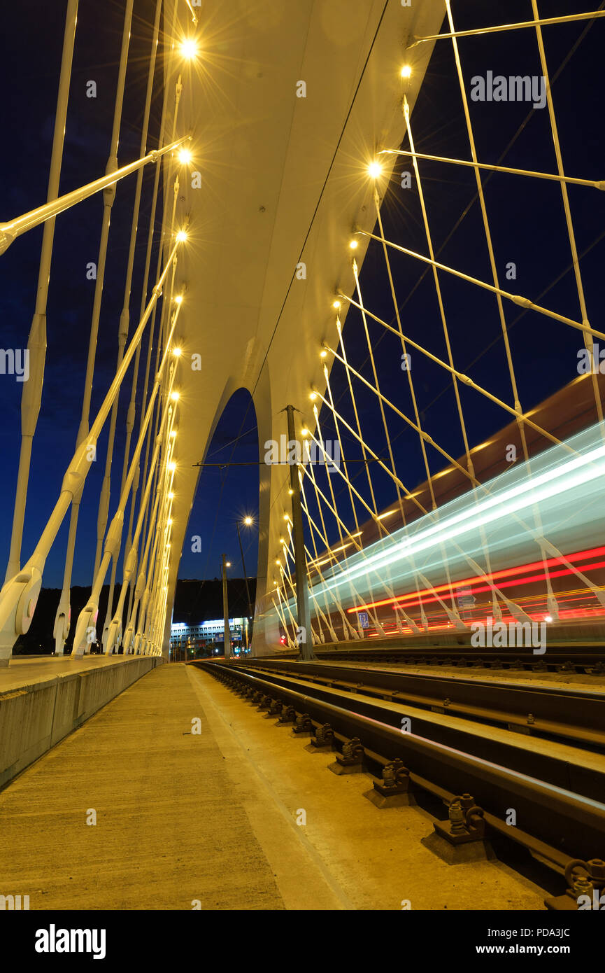 Public transport on modern bridge. Troja bridge in Prague Stock Photo ...