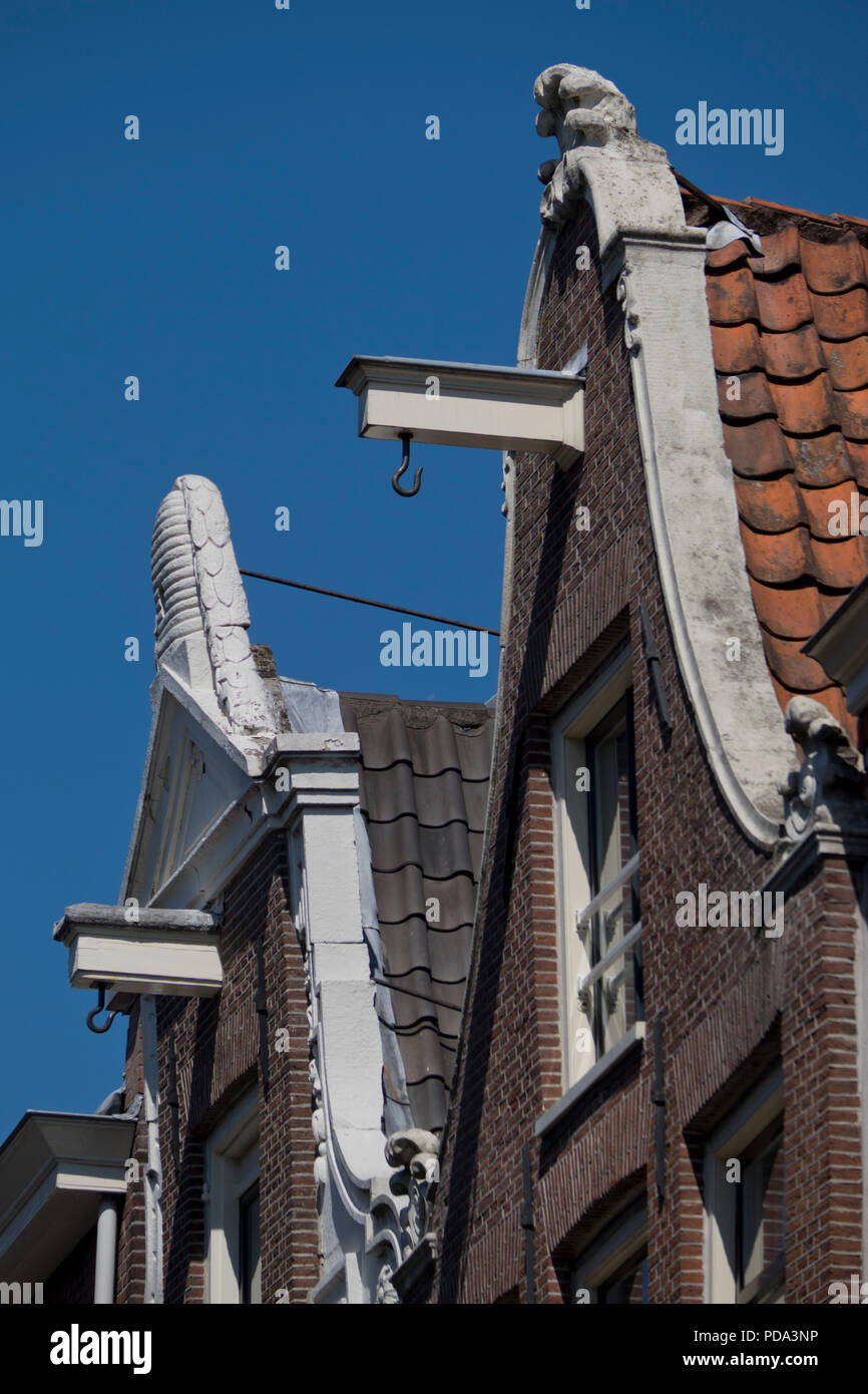 Typical Dutch gabled roof houses with hooks formerly used for elevating ...