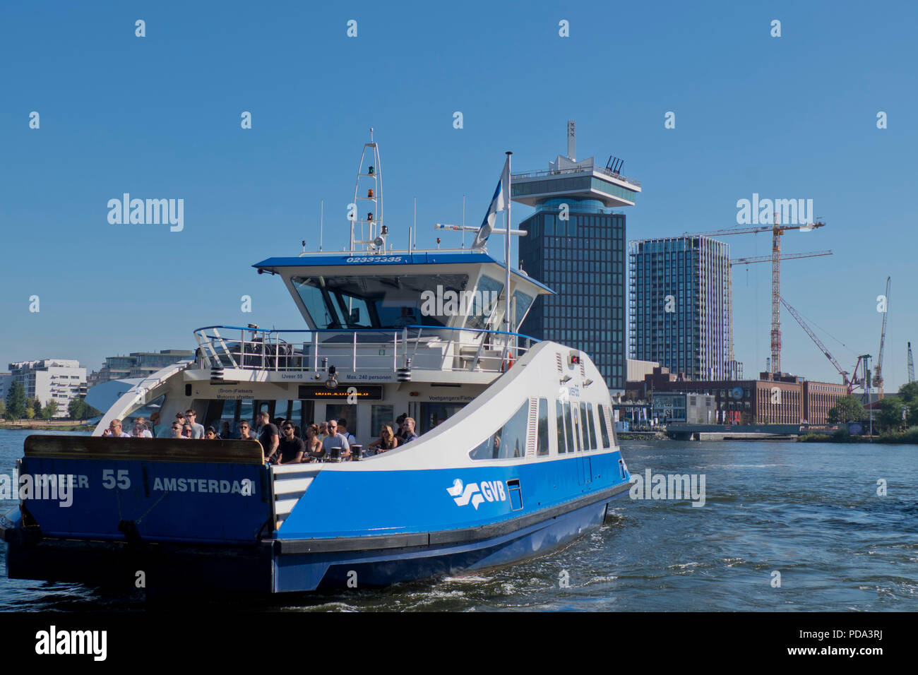 Passenger ferry crossing the harbour in Amsterdam,Holland,Netherlands ...