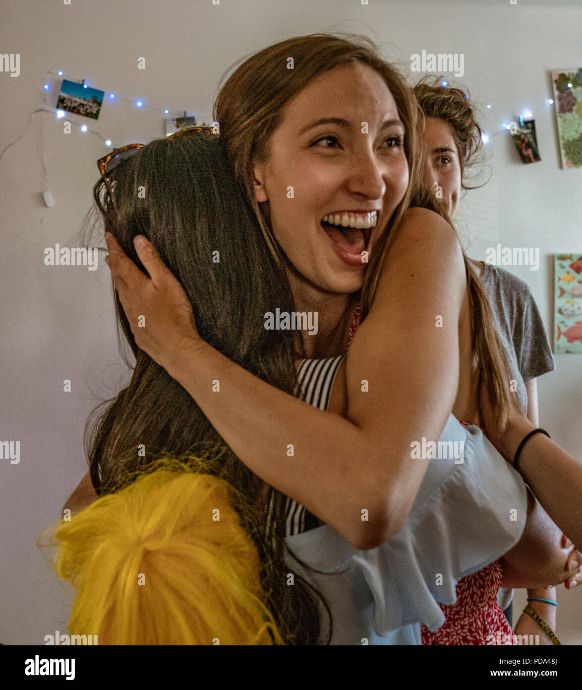 Hug friends greet hi-res stock photography and images - Alamy