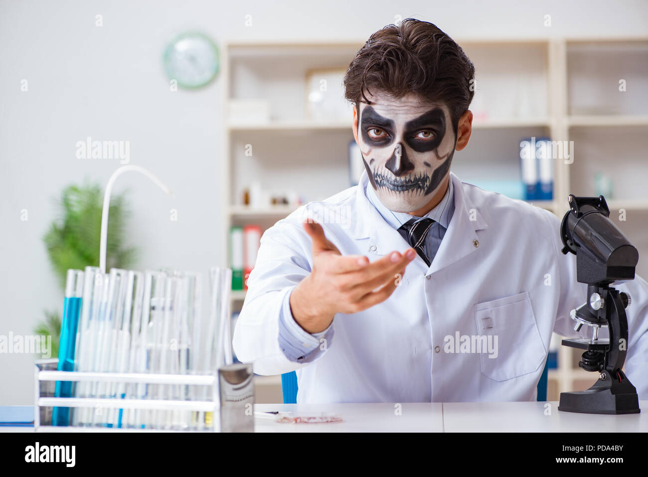 Scary monster doctor working in lab Stock Photo - Alamy